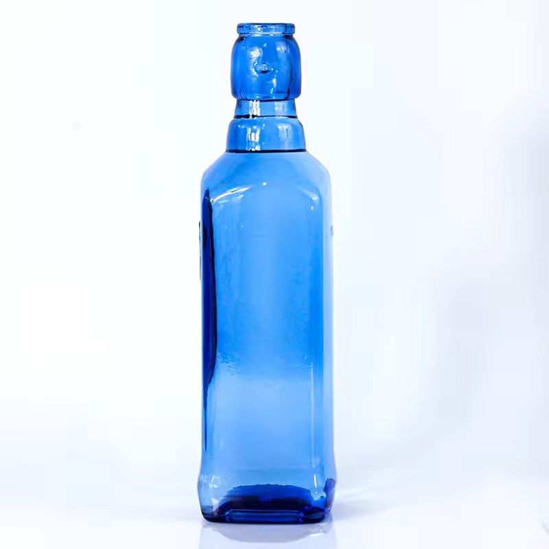 Custom Premium Blue color Glass Bottles With Swing Top Cap For Vodka ...